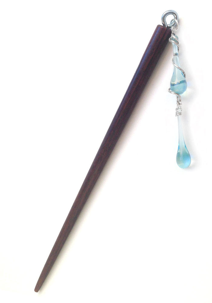Hair stick decorated with dangling sun-melted glass drops